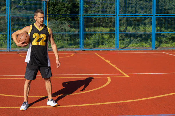 Free Stock Photo of Basketball Player Standing in the Middle of a Court ...