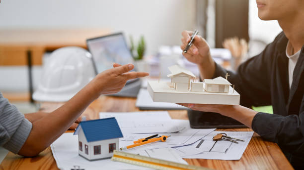 Free Stock Photo of Architect designer explaining house model to client ...