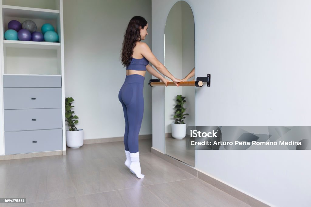 Young Woman Performing Barre Postures Stock Photo - Download Image Now ... Young Woman Performing Barre Postures Stock Photo - Download Image Now ...