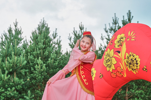 Happy Young Smiling Asian Dancing Girl In Skullcap And Traditional Ethnic Festive Tatar Clothes