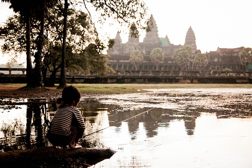Girl Fishing In The Lake Of Angkor Wat Ancient Cambodian City Hidden In ... Girl Fishing In The Lake Of Angkor Wat Ancient Cambodian City Hidden In ...