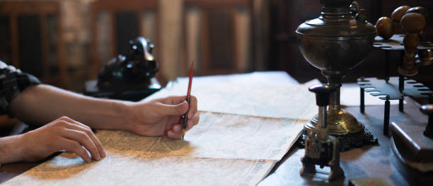 Free Stock Photo of Person pointing a stick at a detailed map on a ...