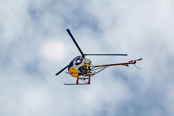 Free Stock Photo of Helicopter Flying Through Cloudy Blue Sky ...