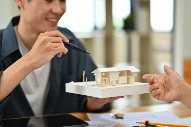 Free Stock Photo of Architect designer explaining house model to client ...