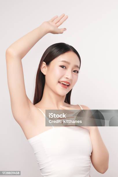 Beautiful Young Asian Woman Lifting Hands Up To Show Off Clean And