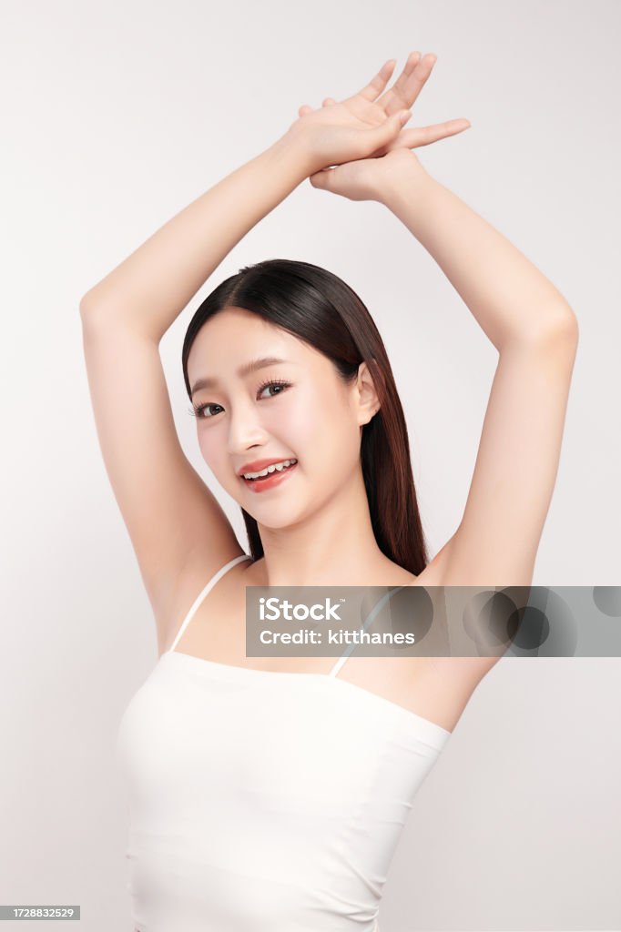 Beautiful Young Asian Woman Lifting Hands Up To Show Off Clean And