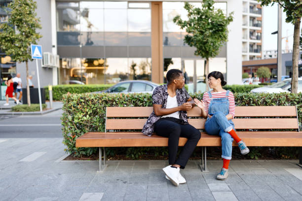 Free Stock Photo of Two People Sitting on Bench in Front of Building ...
