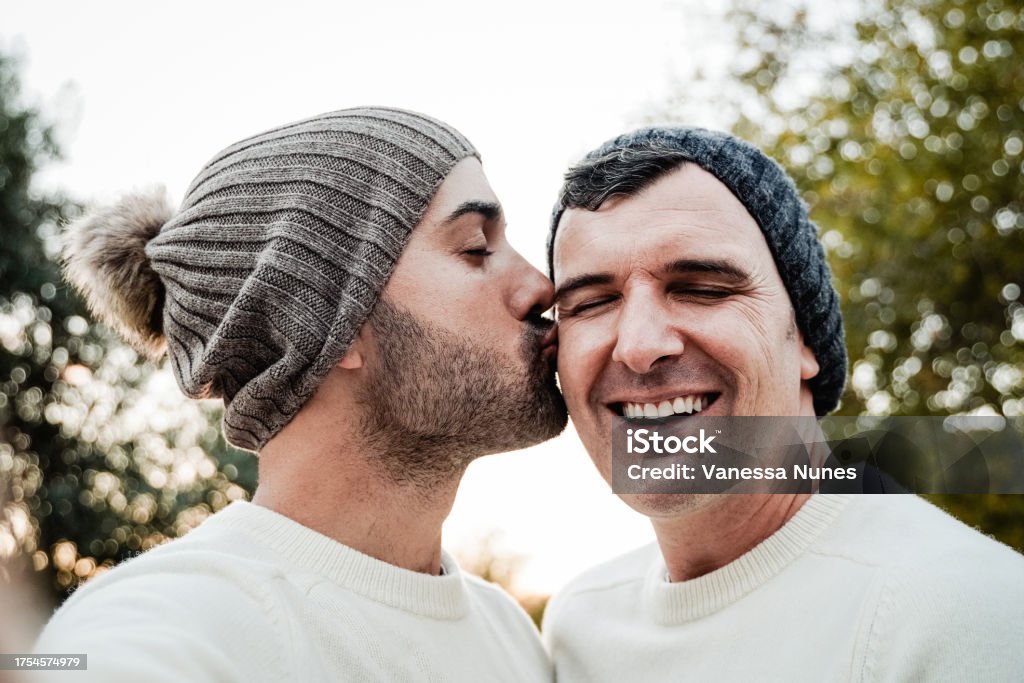 Mature Gay Couple Kissing Outside Male Lovers Taking Selfie Picture