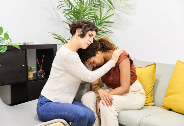 Free Stock Photo of Two people comforting each other on the couch ...
