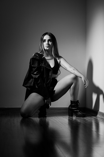 Black And White Portrait Of A Beautiful Young Woman Wearing Casual