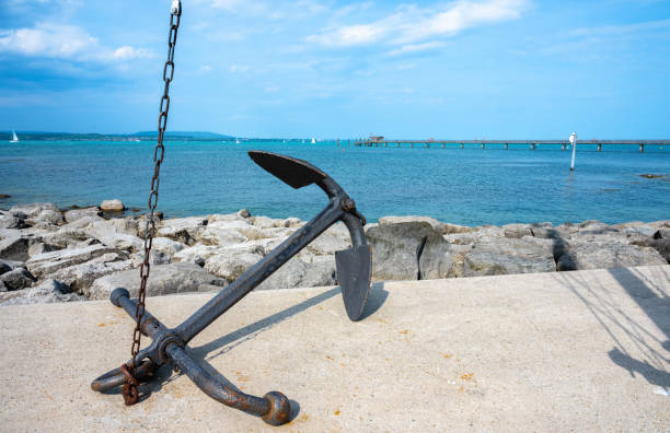 Free picture: Yellow cast iron anchor in water with warning sign