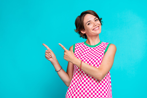 Photo Of Cheerful Pretty Girl Wear Trendy Clothes Showing Billboard