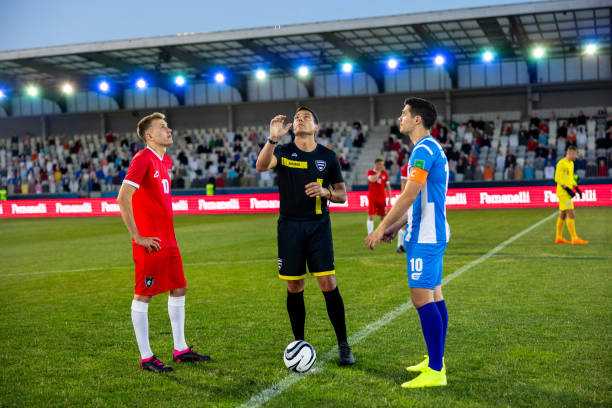 Free Stock Photo of Referee Standing Next to Football Player on Field ...
