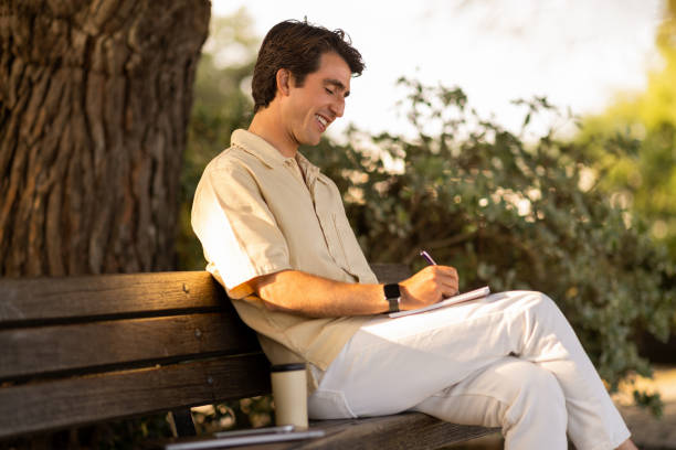 Free Stock Photo of Person Sitting on Bench Writing on Paper | Download ...