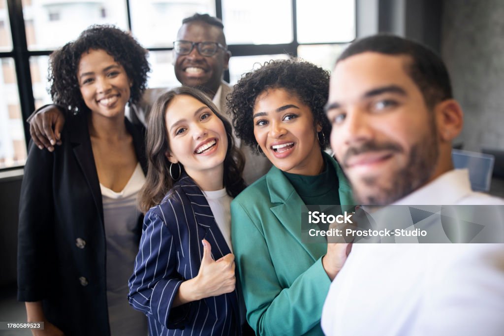 Happy Multiethnic Colleagues Making Group Selfie Posing In Modern