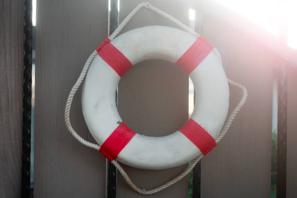 Free Stock Photo of Life Preserver Hanging on White Wall | Download ...