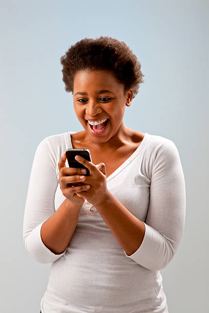 3,000+ Excited Black Woman Holding Phone Stock Photos, Pictures ... 3,000+ Excited Black Woman Holding Phone Stock Photos, Pictures ...