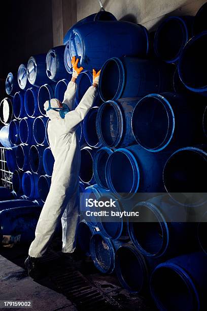 Worker Rolling The Barrel With Toxic Substance Stock Photo - Download ... Worker Rolling The Barrel With Toxic Substance Stock Photo - Download ...