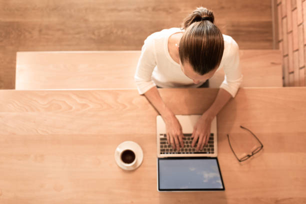Free Stock Photo of Businesswoman working on laptop in office - looking ...