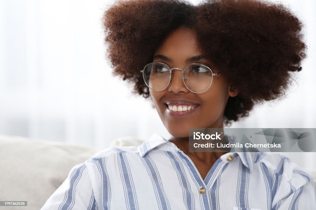 Portrait Of Smiling African American Woman Wearing Glasses At Home