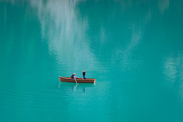 Free Stock Photo of Two People Rowing a Boat on a Lake | Download Free ...
