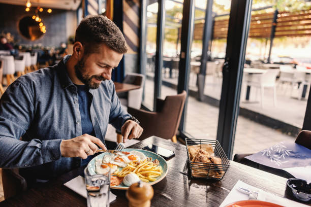 Free Stock Photo of Man eating at a contemporary restaurant | Download ...