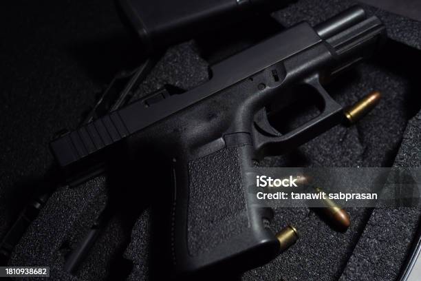 Closeup Of Two Black Metal 9mm Automatic Pistols With Bullets All ... Closeup Of Two Black Metal 9mm Automatic Pistols With Bullets All ...