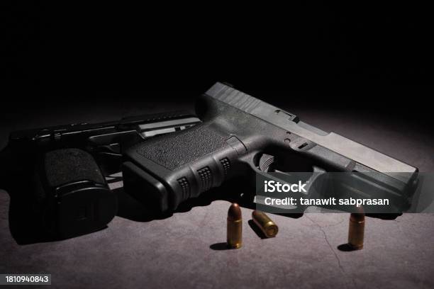 Closeup Of Two Black Metal 9mm Automatic Pistols With Bullets All ... Closeup Of Two Black Metal 9mm Automatic Pistols With Bullets All ...
