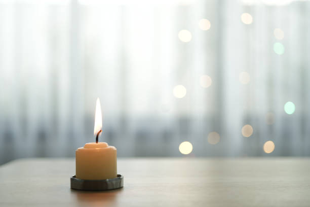 Free Stock Photo of Woman Holding Lit Candle in Front of Curtain ...
