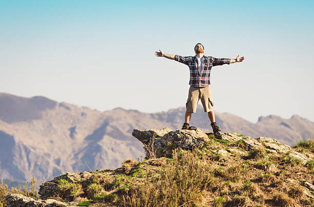 Free Stock Photo of Man Standing on Top of a Mountain by River ...