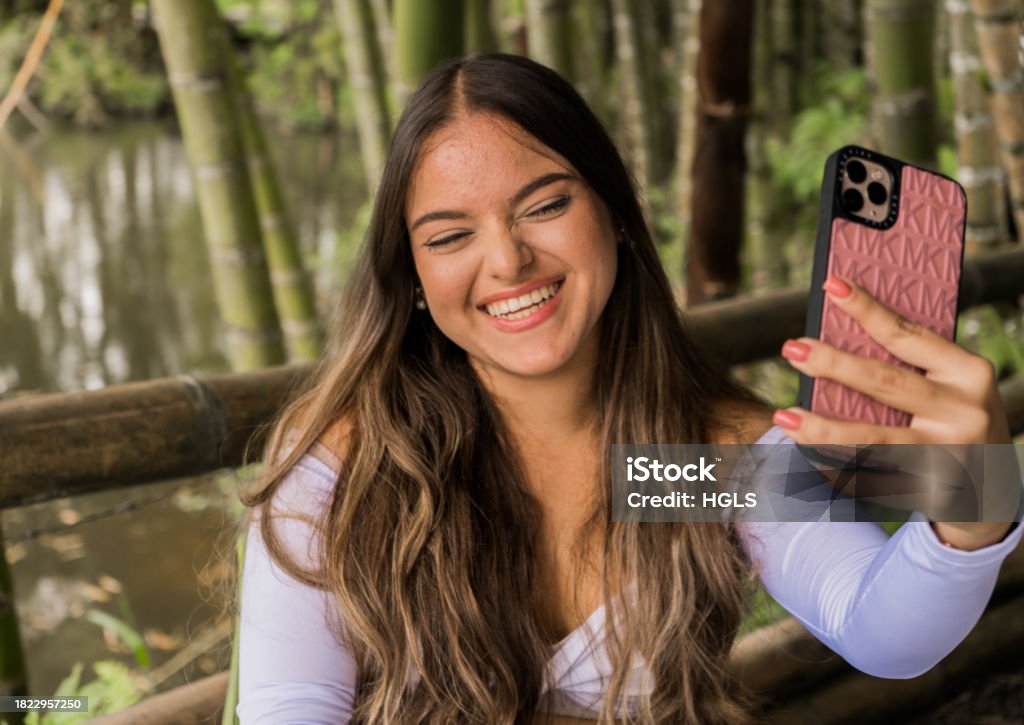 Portrait Of Beautiful Woman Taking A Selfie While Standing In An