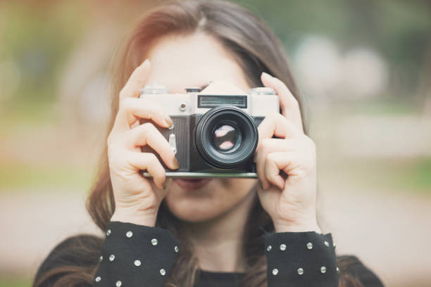Free Stock Photo of Woman Holding Up Camera to Take Picture | Download ...
