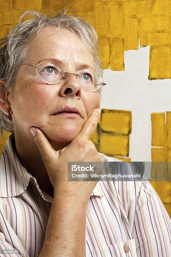 Vertical Portrait Of Pensive Senior Caucasian Woman With Cross Sign ... Vertical Portrait Of Pensive Senior Caucasian Woman With Cross Sign ...