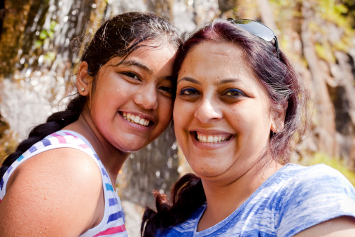 Cheerful Indian Mother And Daughter Enjoying Their Outdoor Vacations