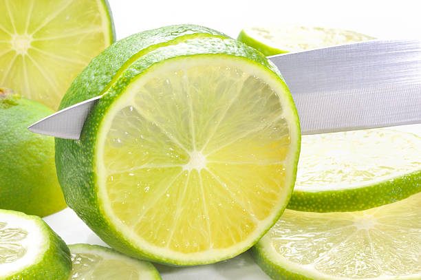 Free Stock Photo of Lime Cut in Half With Knife Sticking Out | Download ...