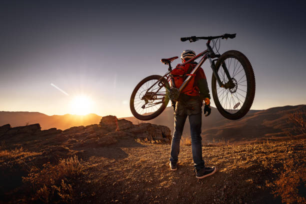Free Stock Photo of Person Riding a Bike on a Hill at Sunset | Download ...