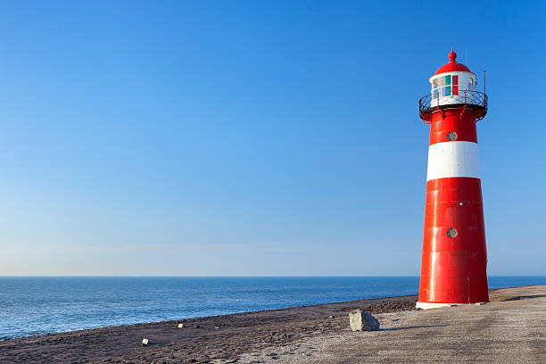 Free Stock Photo of Red-topped lighthouse standing by the sea ...