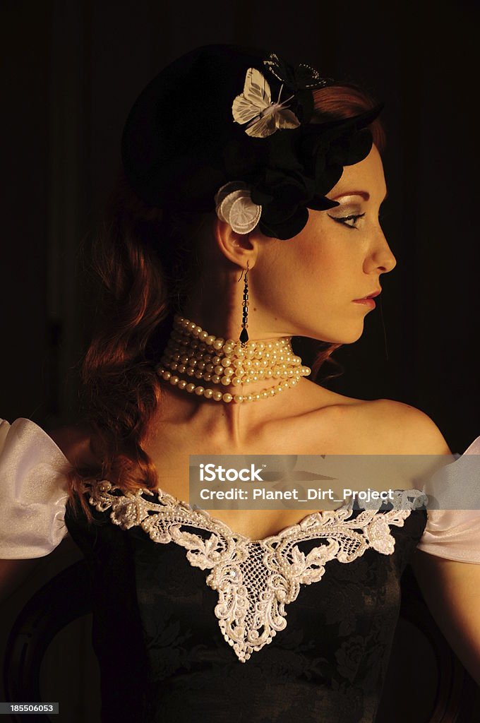 Vintage Victorian Glamour Redhead Lady Sitting In Dress With Hat Stock