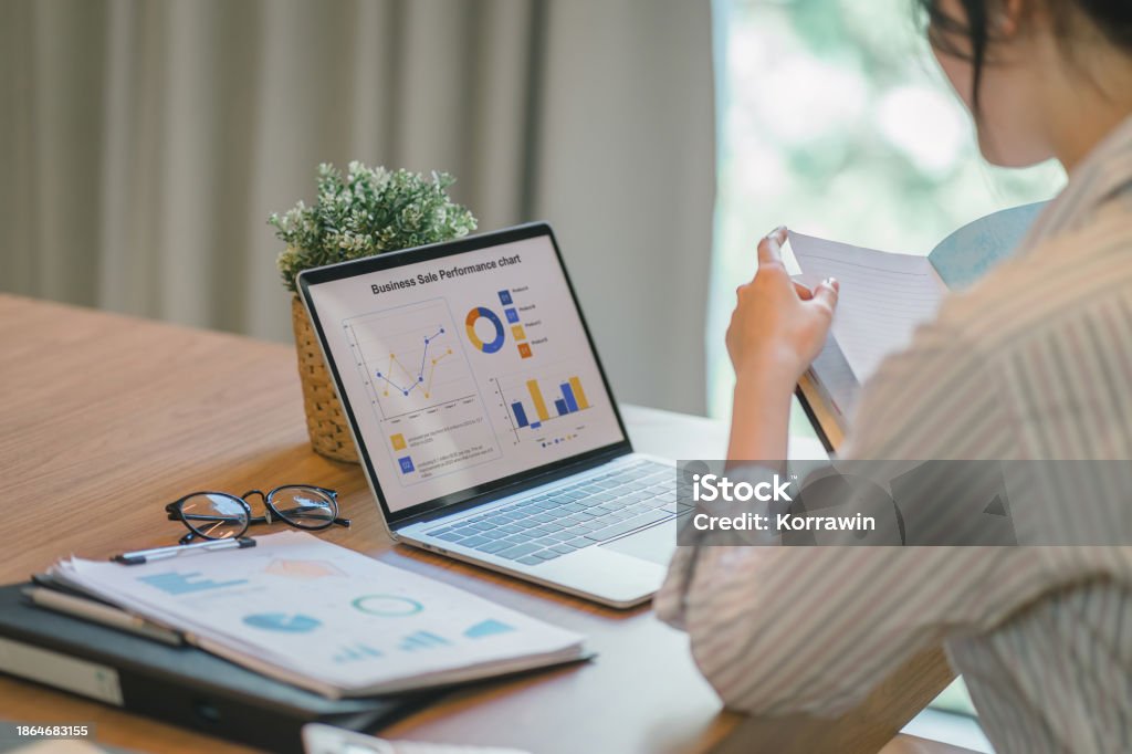 A Female Analyst Analyzes Kpi Business Analytics Data Dashboard ... A Female Analyst Analyzes Kpi Business Analytics Data Dashboard ...