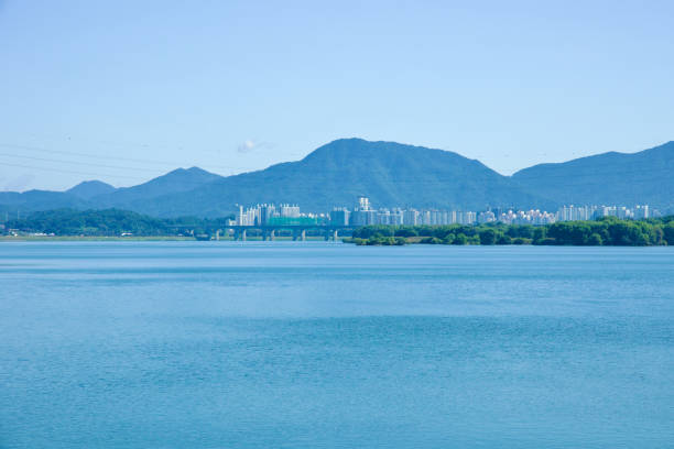 Free Stock Photo of Waterfront Cityscape With Mountain Range | Download ...