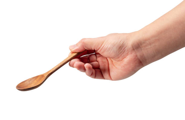 Free Stock Photo of A hand holding a wooden spoon in water | Download ...