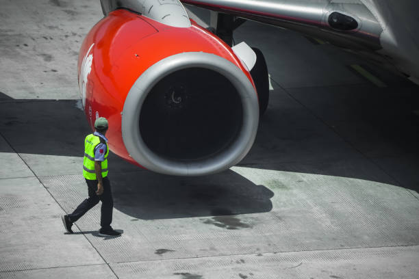 Free Stock Photo of Man Standing Next to Large Jet Engine | Download ...