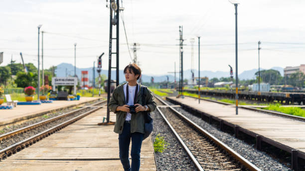 Free Stock Photo of Man Walking Across Train Track Towards Camera ...