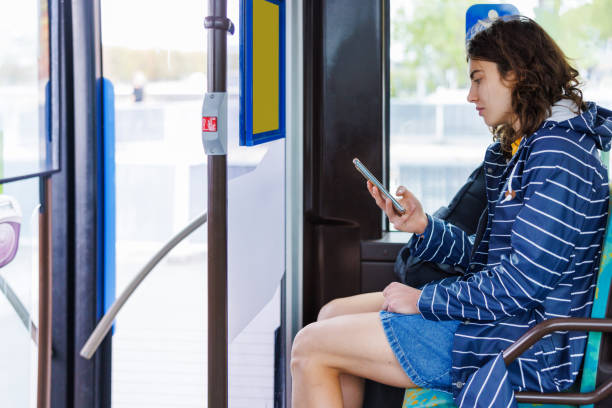 Free Stock Photo of Woman Sitting on Blue Bus With Legs Crossed ...