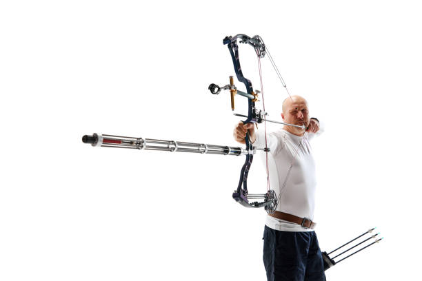Free Stock Photo of Man Holding Bow and Arrow in Front of Target ...