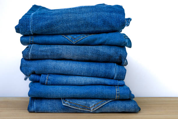 Free Stock Photo of Several Pairs of Jeans Stacked on Shel | Download ...
