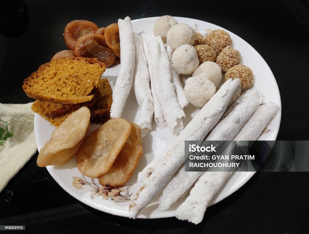 Assamese Food Known As Pitha And Laru Prepared During Bihu Festival In