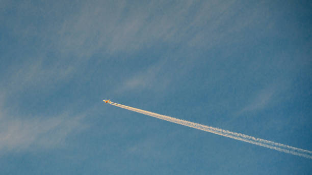 Free Stock Photo of A jet flying in the sky with the sun behind it ...