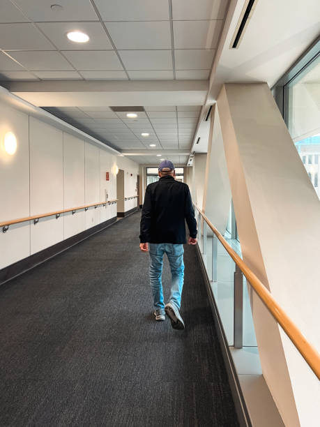 Free Stock Photo of Man Walking Down Long Hallway | Download Free ...