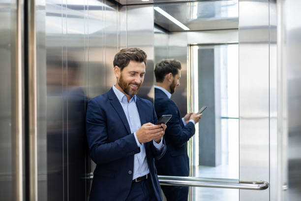 Free Stock Photo of Man waiting for an elevator in a hallway | Download ...